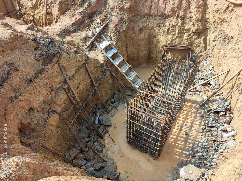 Pile cap and column stump under construction at the construction site ...