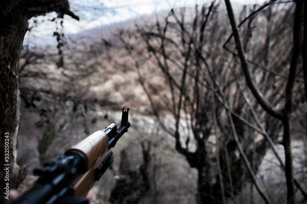 Shooter aiming target with assault rifle weapon. dangerous bandit ...