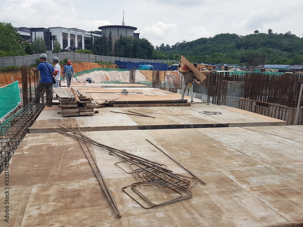 Building floor slab under construction. Construction workers ...