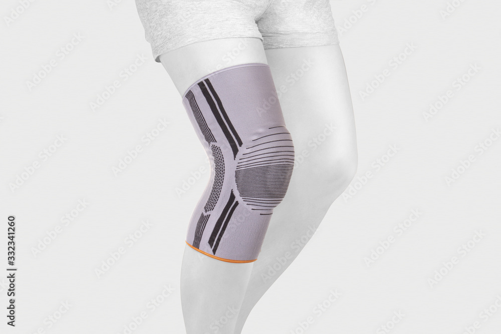 Knee Support Brace on leg isolated on white background. Orthopedic ...