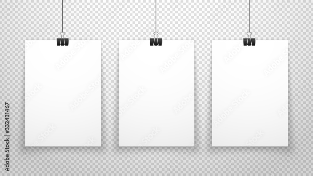 Paper poster. White blanks sheets hanging on wall. Three posters ...