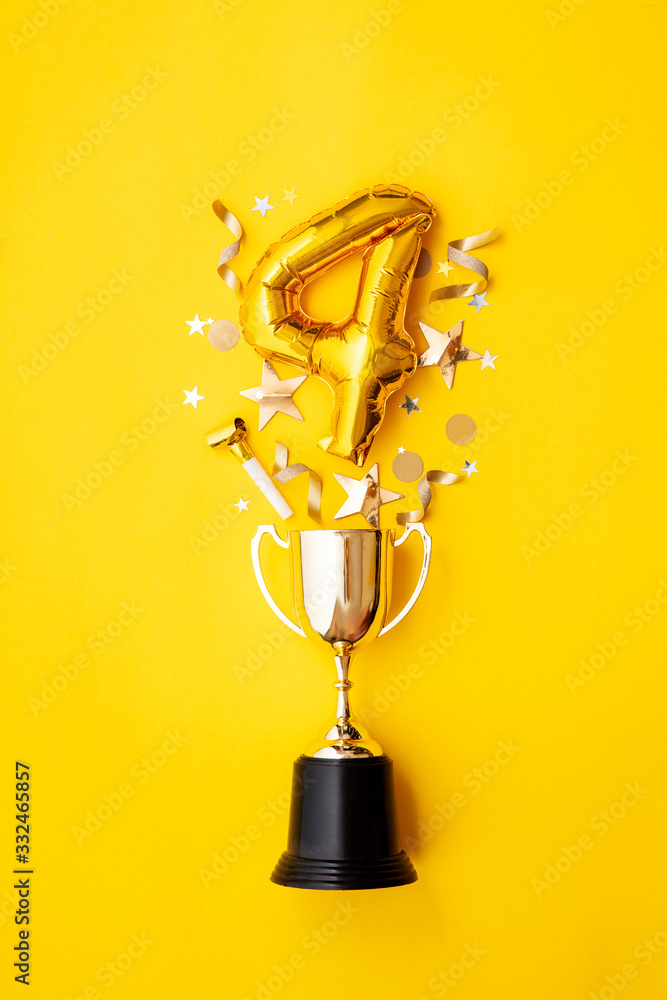 Foto de Stock Number 4 gold anniversary celebration balloon exploding ...