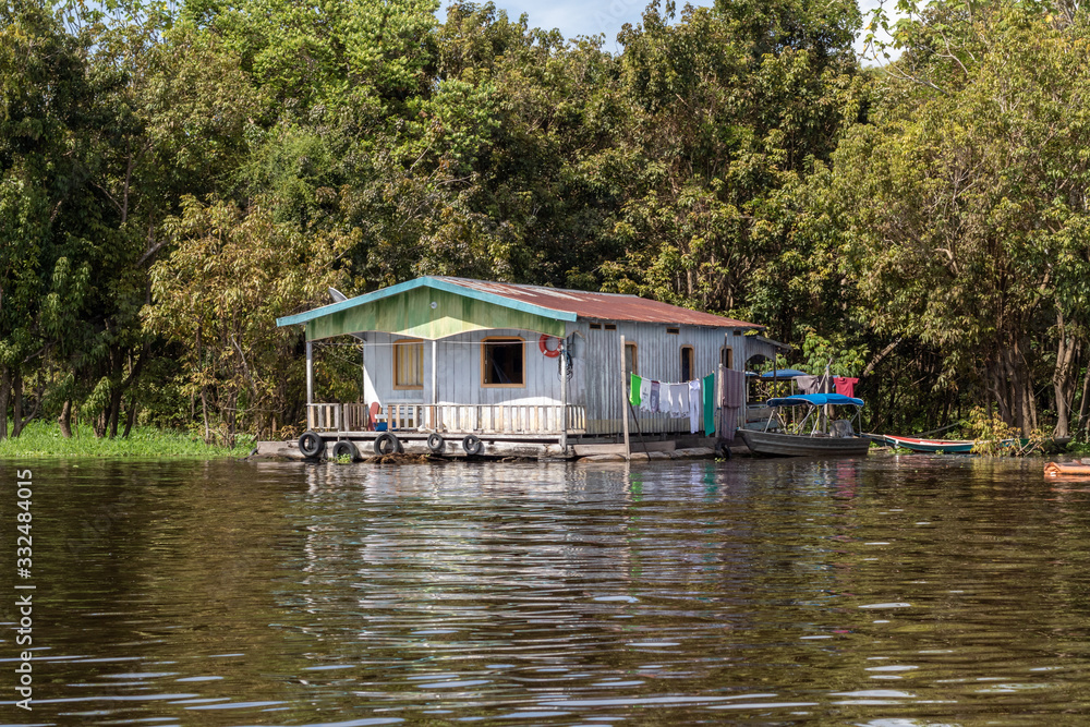 floating house in the amazon river Stock Photo | Adobe Stock