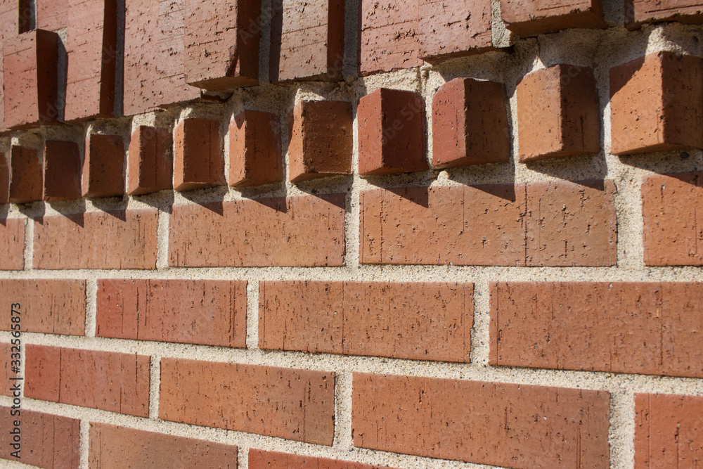 Traditional red and brown brick wall texture background with rows of ...