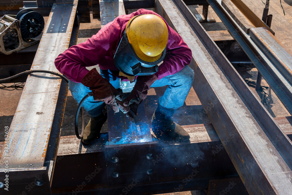 Stockfoto The welder is welding a steel structure work with process ...