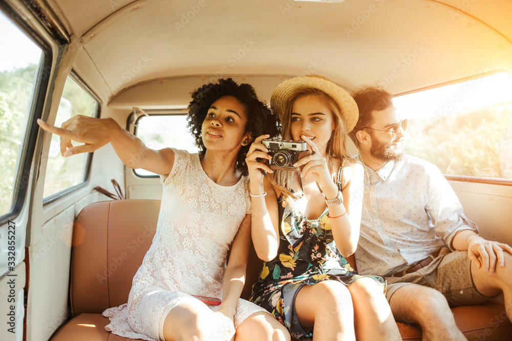 Three best friends travel in a minivan bus and explore new places. Two ...