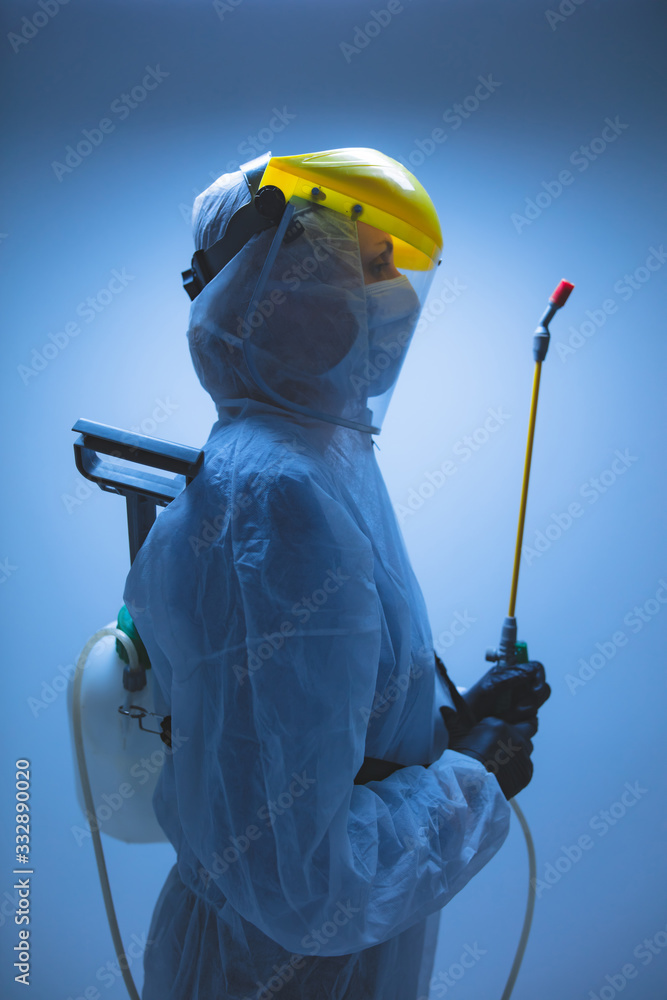 Scientist holding chemical sprayer for sterilization and ...