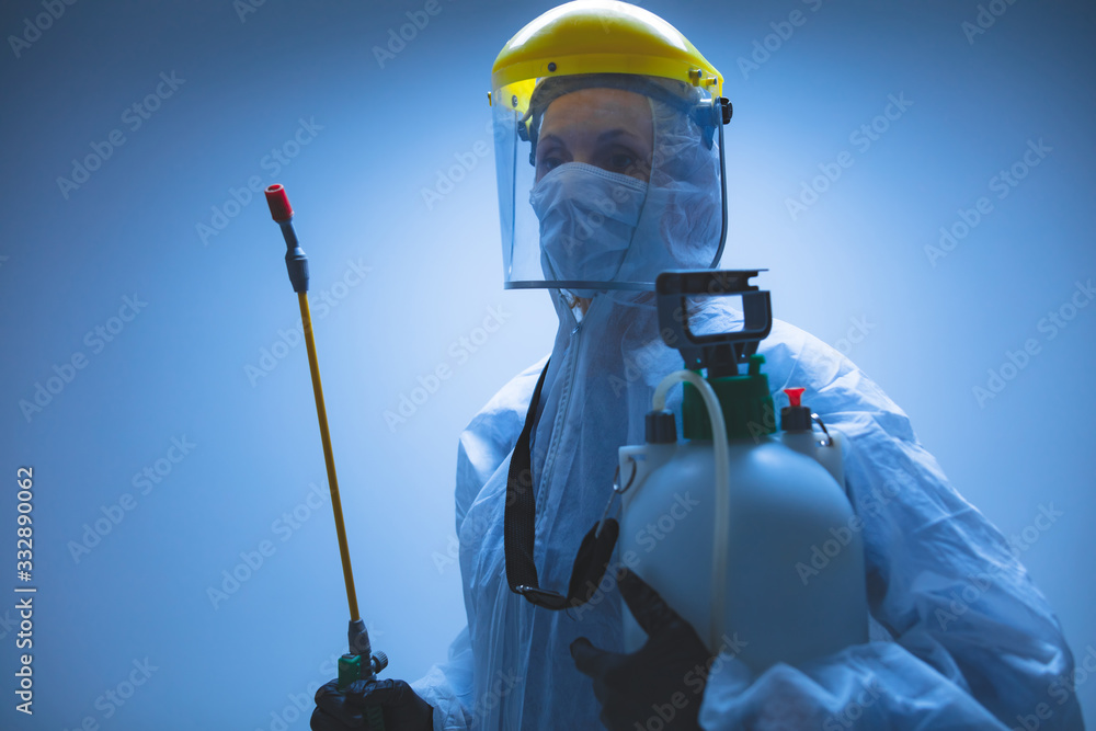 Scientist holding chemical sprayer for sterilization and ...