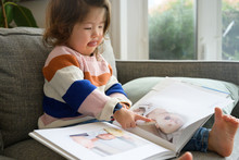 Baby Looking At The Book Free Stock Photo - Public Domain Pictures