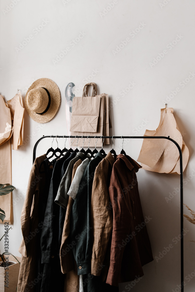 Iron stand with different clothes. Stock Photo | Adobe Stock