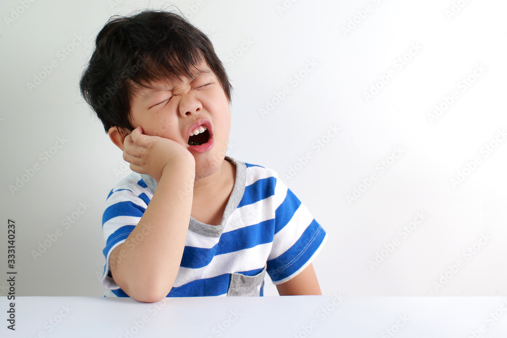 Little Asian boy with toothache action isolated on white background ...
