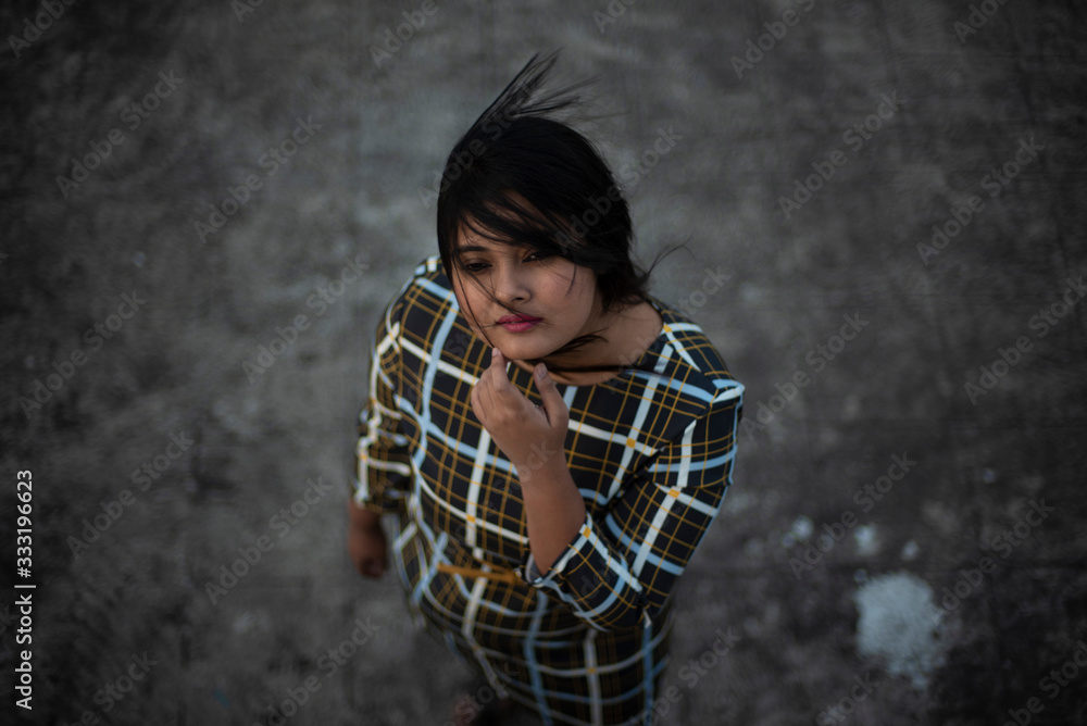Top down portrait of an young brunette Indian Bengali brunette plus ...