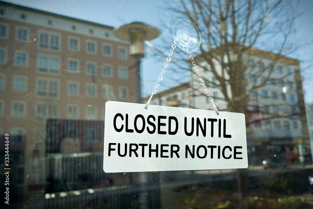Sign on a shop window with the inscription closed until further notice ...