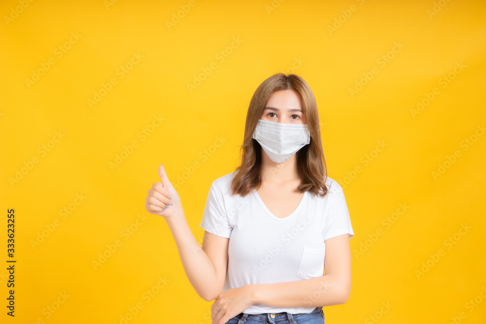 Asian women thumbs up wear correct masks to protect against germs from ...