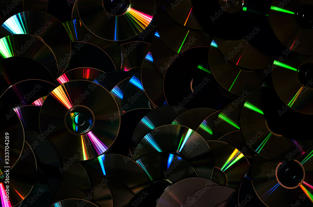 Group of old CD DVD compact optical disk storage medium with dust and ...