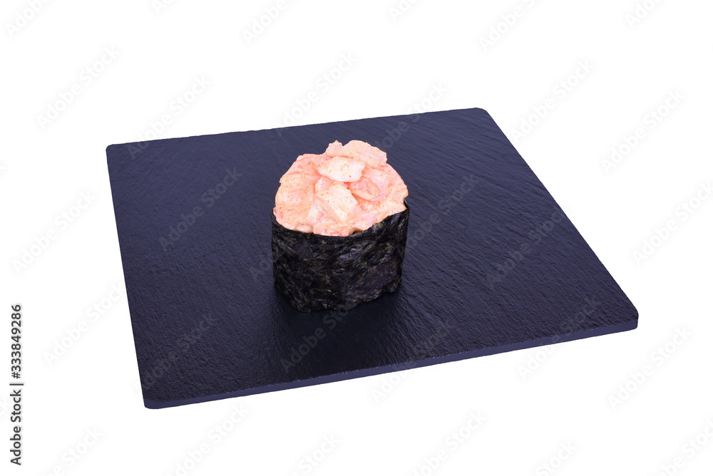 Traditional fresh japanese sushi on black stone Gunkan spicy abi on a ...