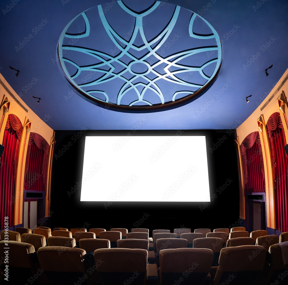 Cinema theater screen in front of seat rows in movie theater showing ...