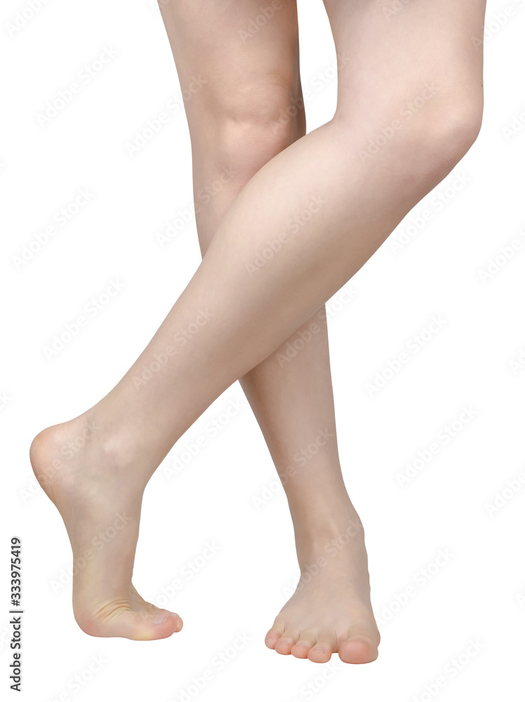 bare feet of a girl with flat feet, barefoot, legs crossed and one ...