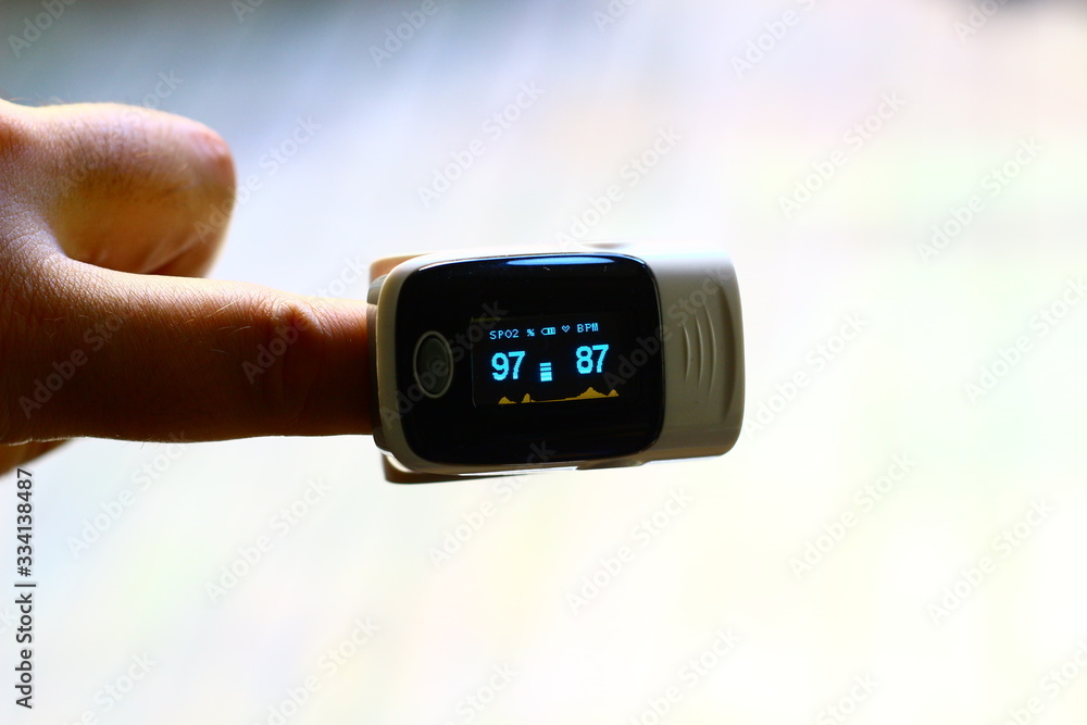 Pulse oximeter measuring oxygen saturation in blood and heart rate ...