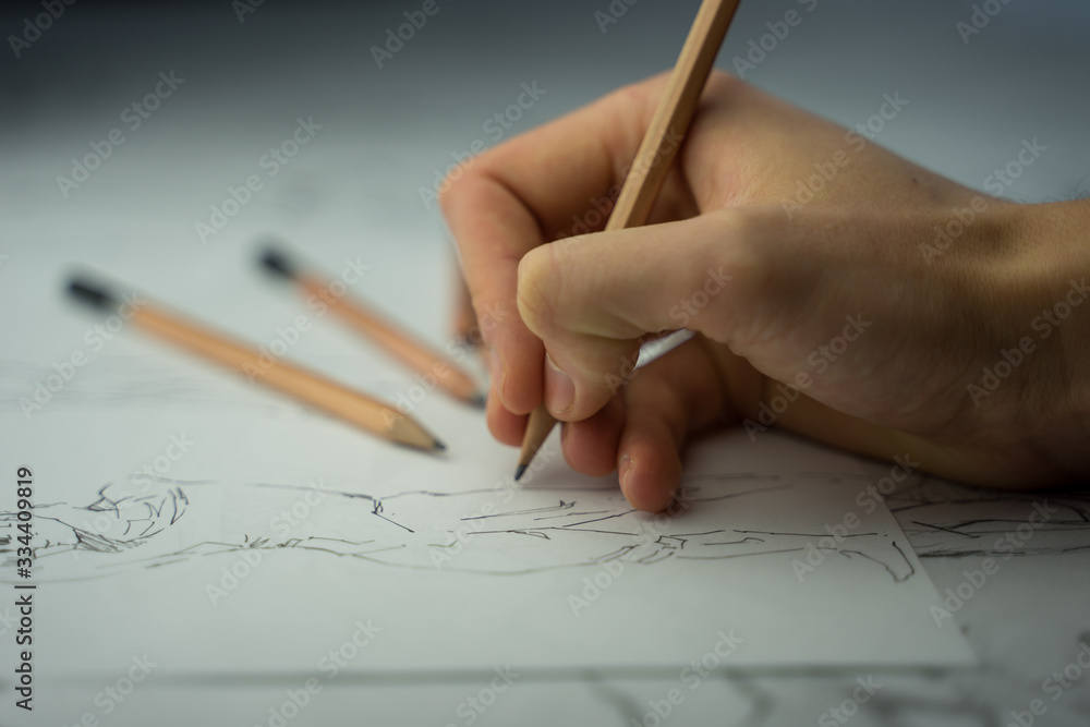 Drawing the human figure with a pencil Stock Photo | Adobe Stock