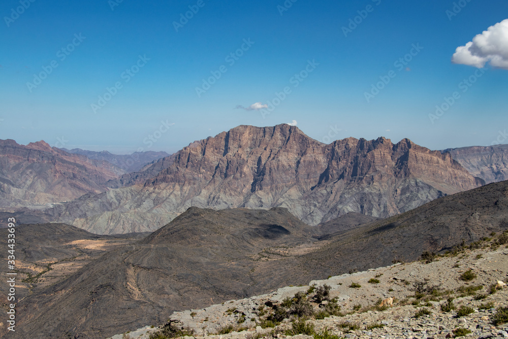 Mountain and valley view along Wadi Sahtan road in Al Hajir mountains ...