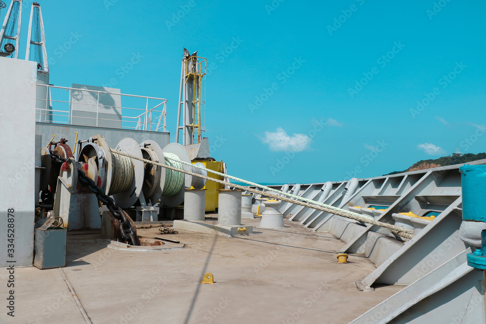 Mooring rope in line bundle on winch holding on main deck and forward ...