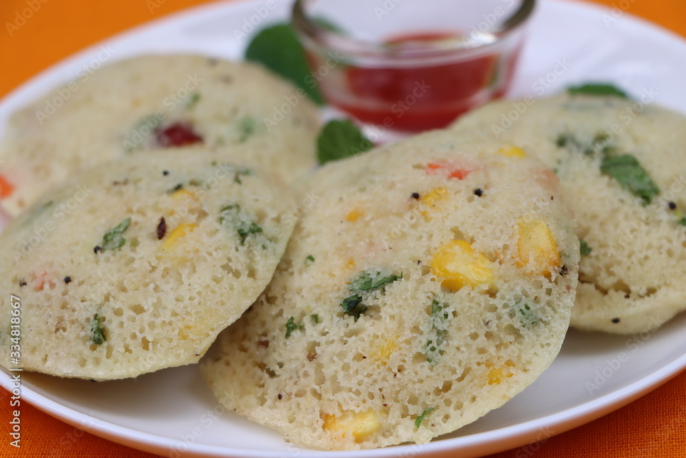Rawa Idli or rava idli or vegetable Idli, Steamed semolina and ...