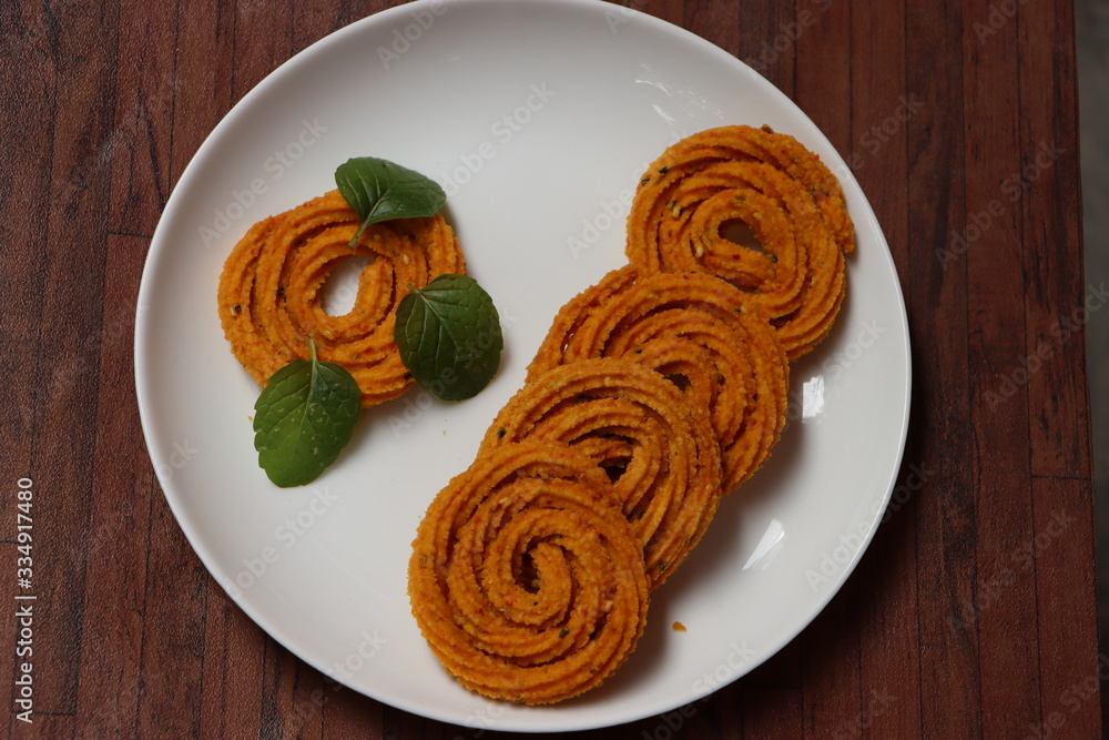 Indian Traditional Snack Chakali, a spiral shaped crisp deep fried ...