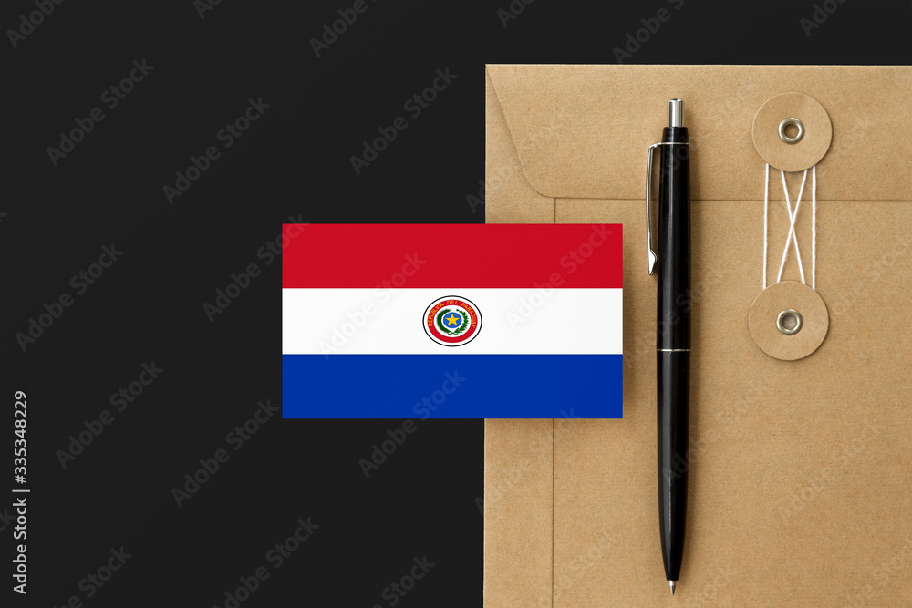 Paraguay flag on craft envelope letter and black pen background ...