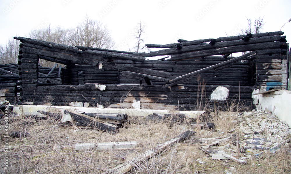 Remains of a wooden building. Angry long ago there was a fire and ...