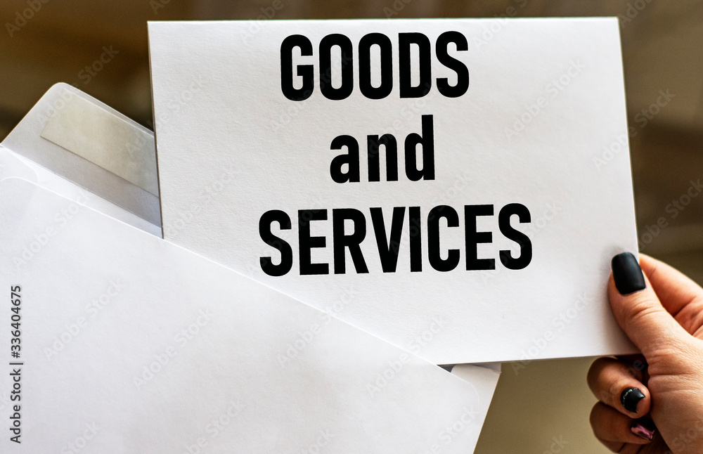GOODS AND SERVICES words written in letter from envelope Stock Photo ...