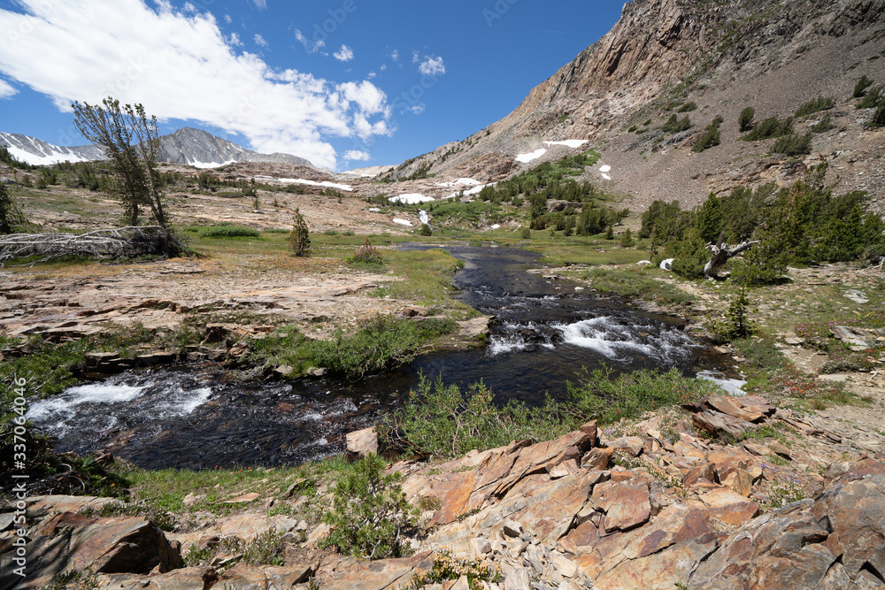 Rushing creek along the 20 Lakes Basin loop hiking in the Eastern ...