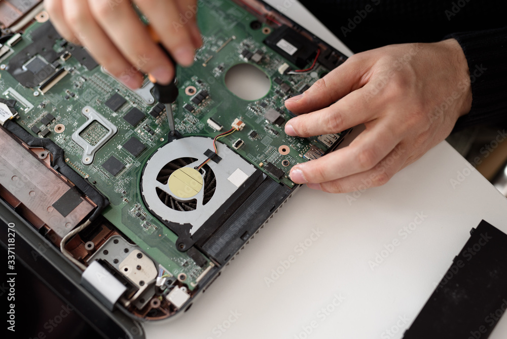Laptop repair. Disassembled computer parts. PC electronic components ...
