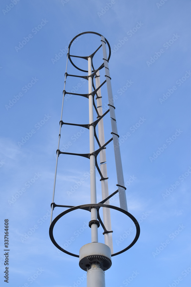 Small wind turbine in a city. Urban eco-friendly power generation ...