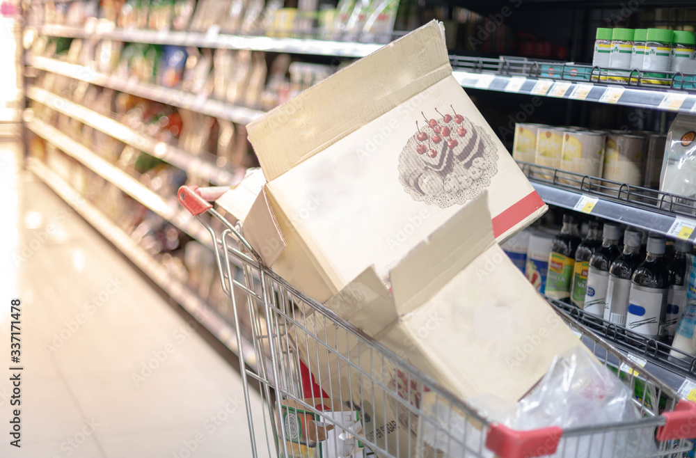 Empty carton in the stainless trolley at Supermarket aisle preparing ...