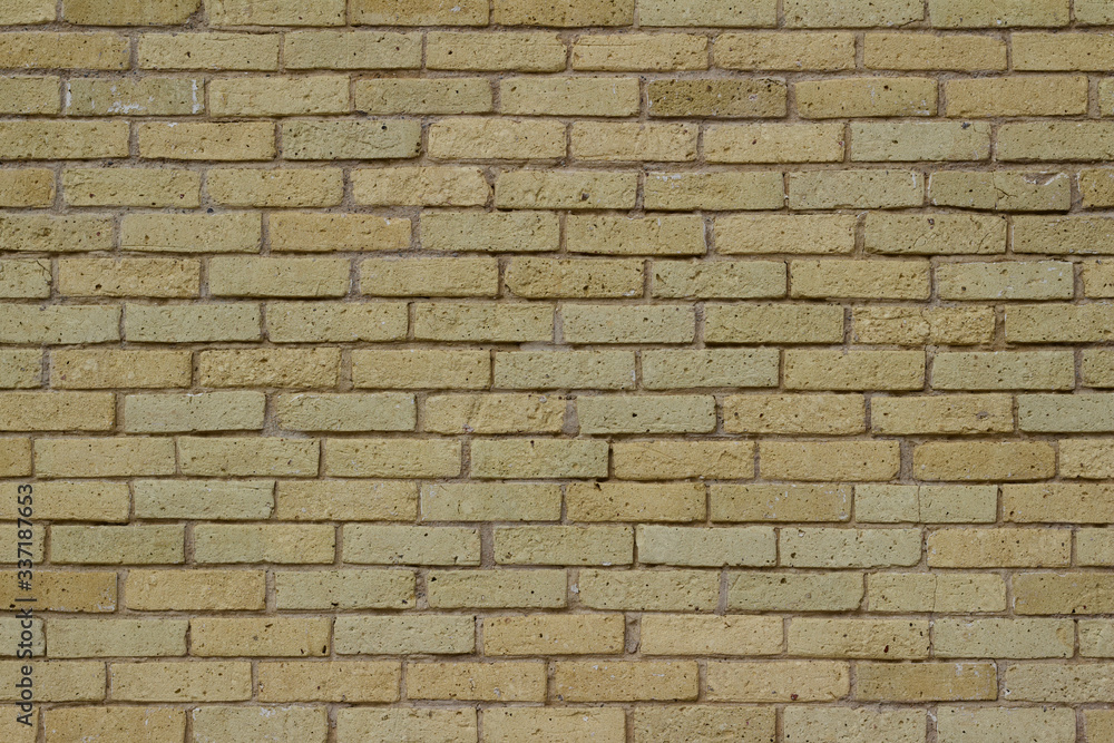 Shabby chic old yellow brick wall texture background with natural ...