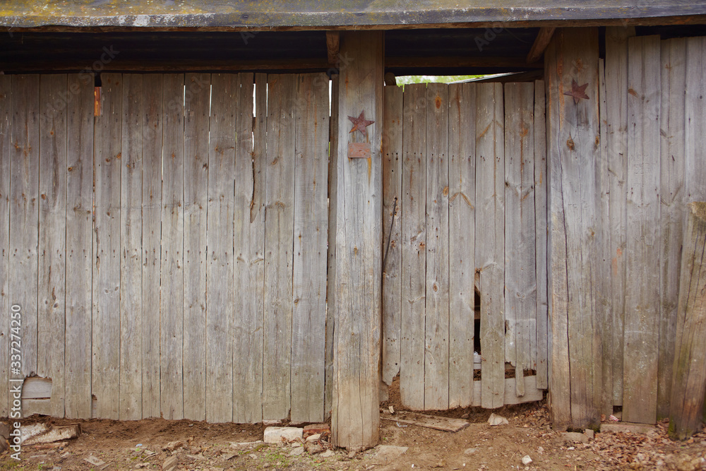 Old wooden gate of a village house where a military veteran once lived ...
