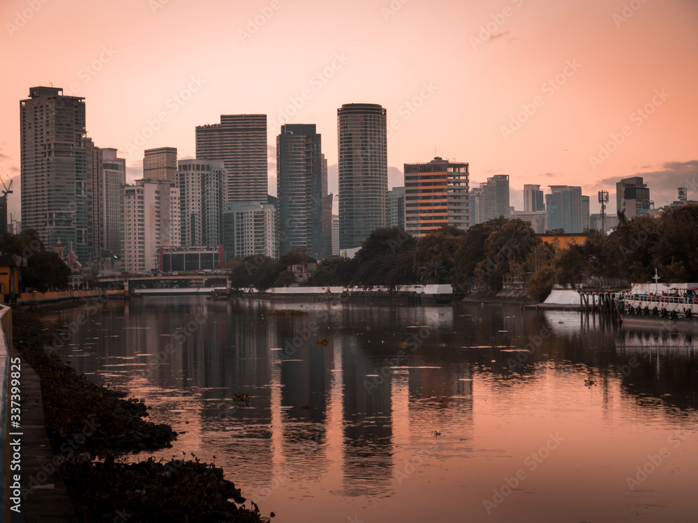 Skyline of Makati City reflecting in the Pasig River in Metro Manila ...