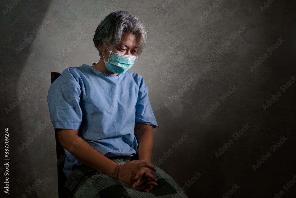 covid-19 virus spreading disease - scared and sad mature woman with ...