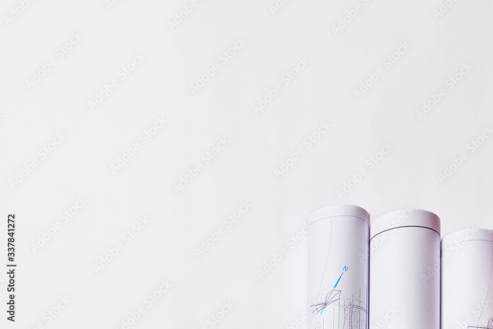 Rolled engineering drawings at white background with copy space Stock ...