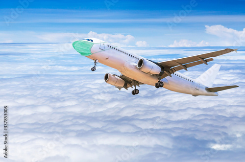 White commercial airplane wearing hygienic surgical face mask for ...