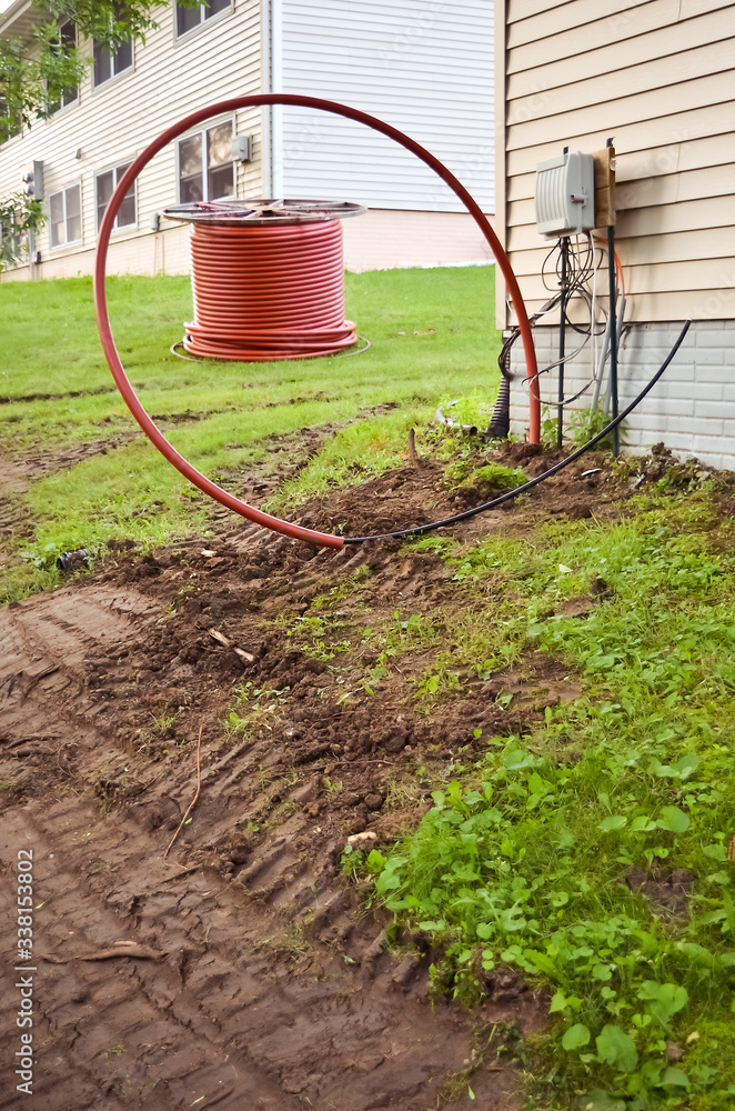 Spool of Cable and Buried Cable Connecting to a Building Stock Photo ...