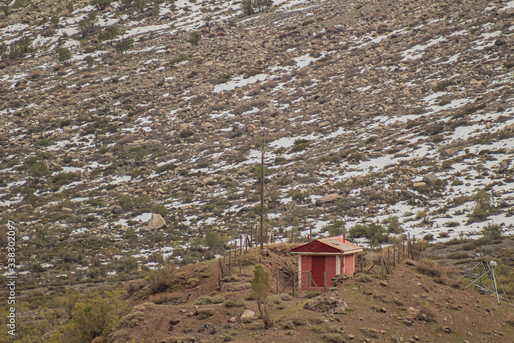 Little house on the mountain slope in Lo Valdés Valley, Cajón del Maipo ...