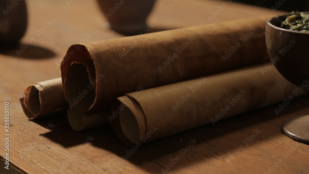 Bible scene: a wooden dining table with scripture scrolls. Close-up of ...