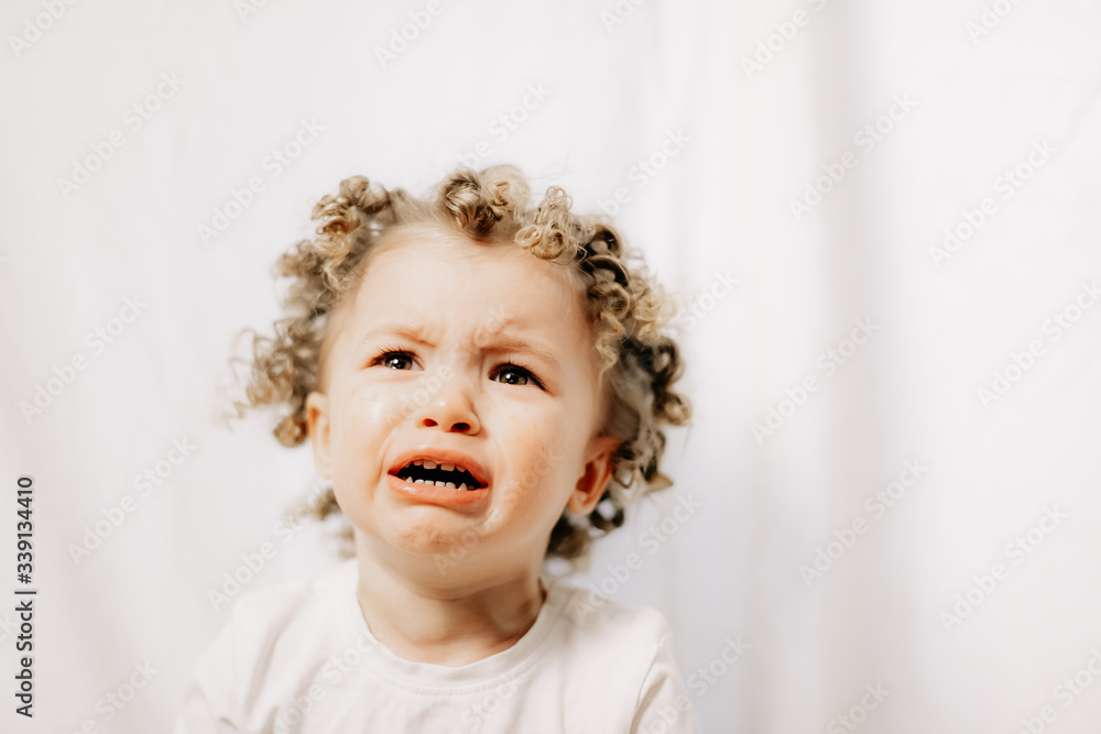 Photo Stock Portrait of beautiful baby girl crying emotionally. Child ...
