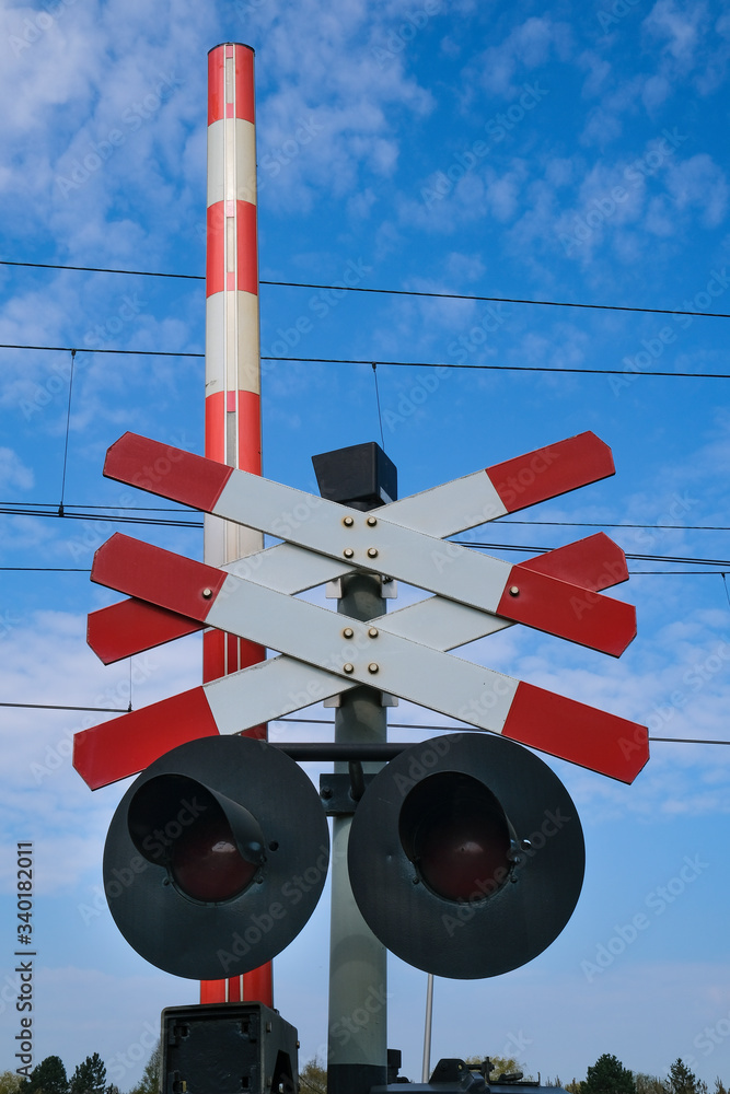 Road signs at the railway crossing with a barrier. Organization of the ...