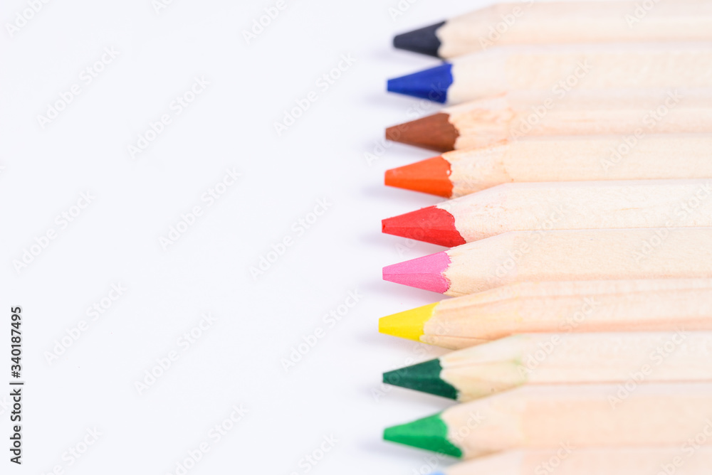 colored pencil in a row, color pencils ina raw on white background ...
