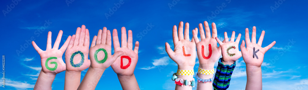 Kids Hands Holding Colorful English Word Good Luck. Blue Sky As ...