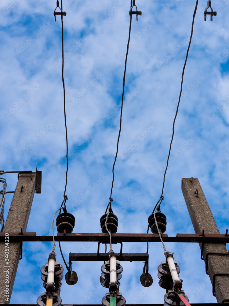 Electricity power cables connection to the grid; three power lines and ...
