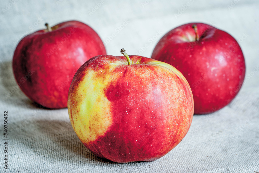 red and yellow apples covered with water drops as background. Red green ...